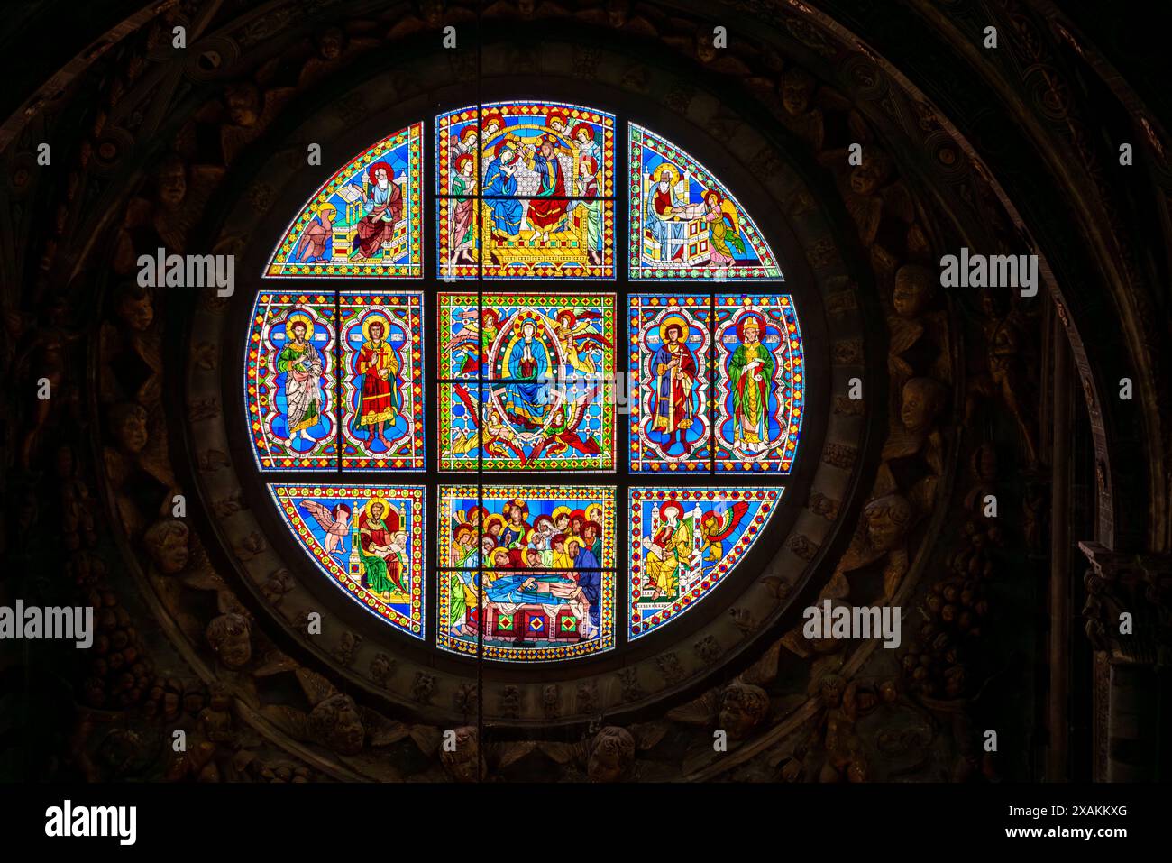 SIENA, ITALY - SEPTEMBER 23, 2023 - Rich ornate window with mother mary ...