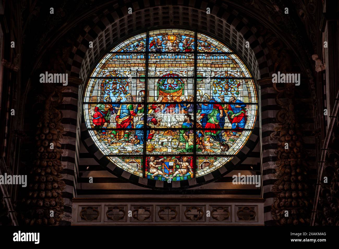 Rich ornate window of the nave of the Siena Cathedral in Italy, showing ...