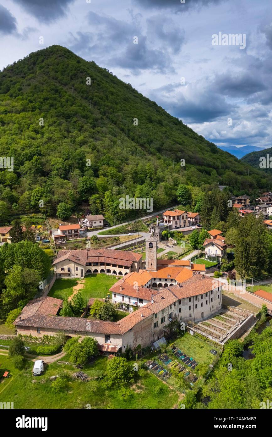 Aerial view of the ancient Badia di San Gemolo in Ganna on a spring day ...