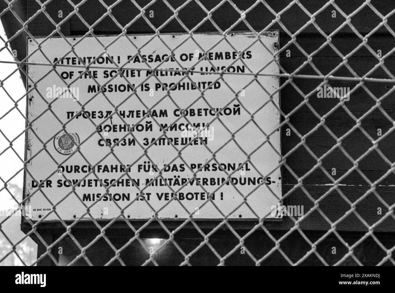 Prohibition sign in English, Russian and German: 'Passage for the ...