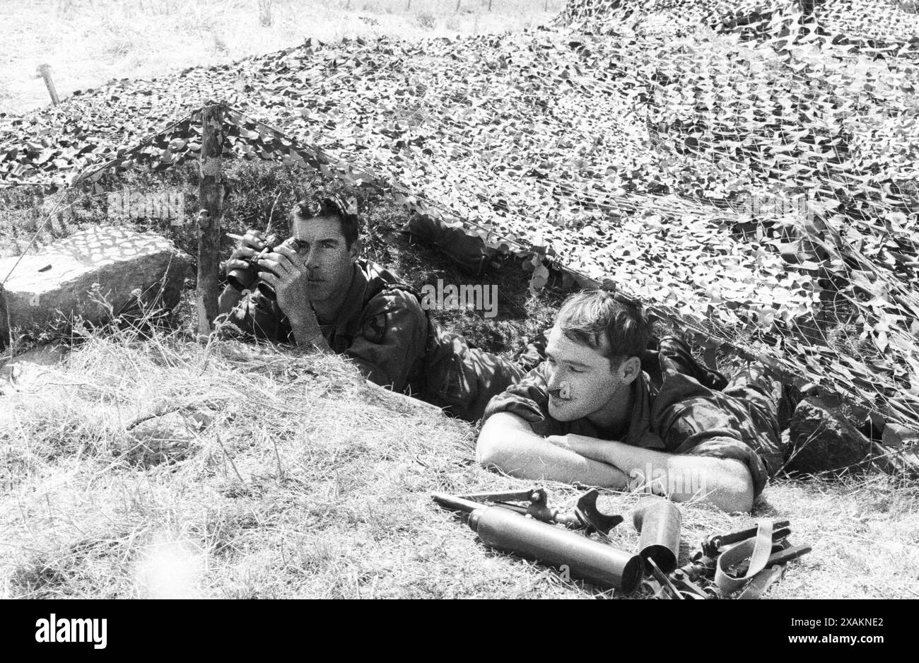 US soldiers under camouflaged observation post follow events at the ...