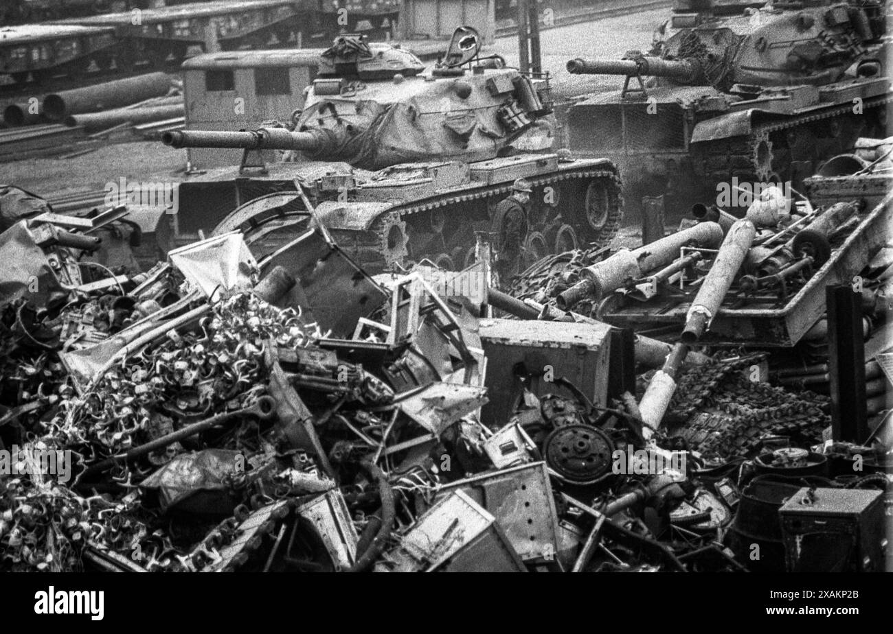 US tanks pass behind a scrap yard at the train station, actions of the ...