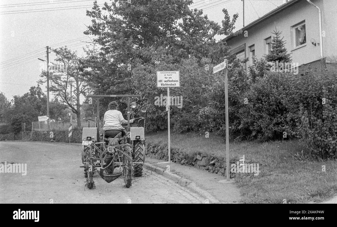 Farmer on tractor passes road sign with the inscription: 'ABC ...