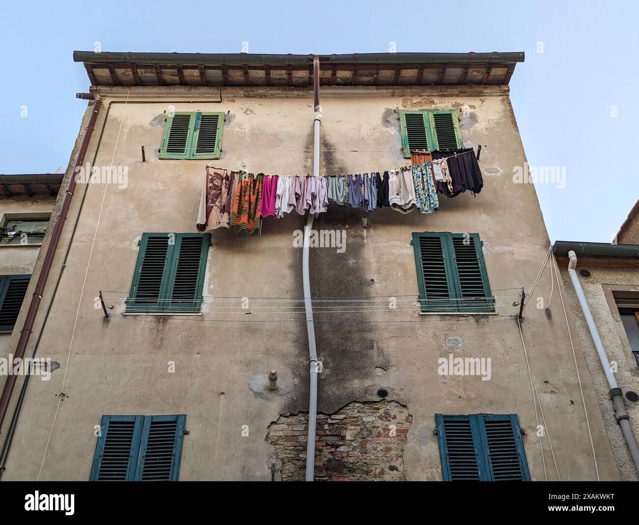 Drying laundry at the facade of an oldresidential house in the Tuscany ...
