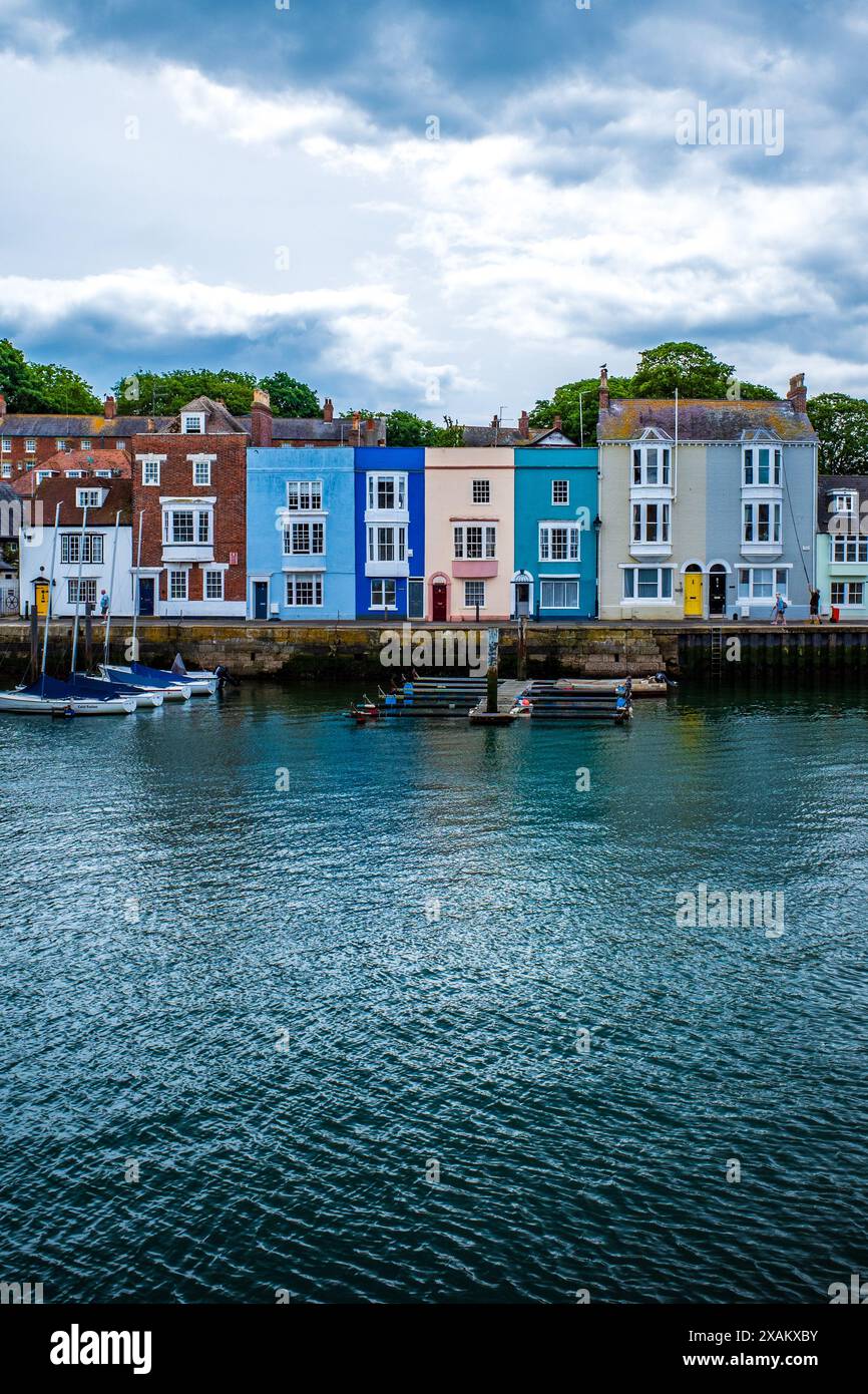 Weymouth Harbour in Dorset, England. Colourful buildings line the ...