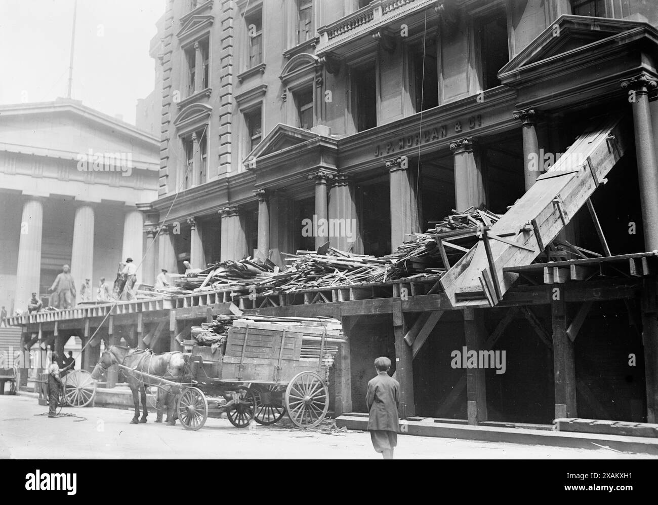 Tearing down Morgan offices, 1913. Shows the demolition of the J.P ...