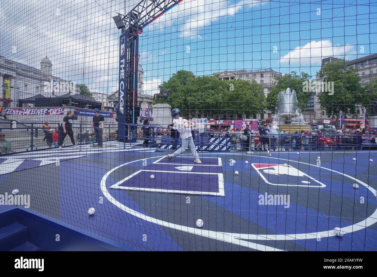 London, UK. 7 June 2024. A baseball fan hits the ball inside a cage as ...