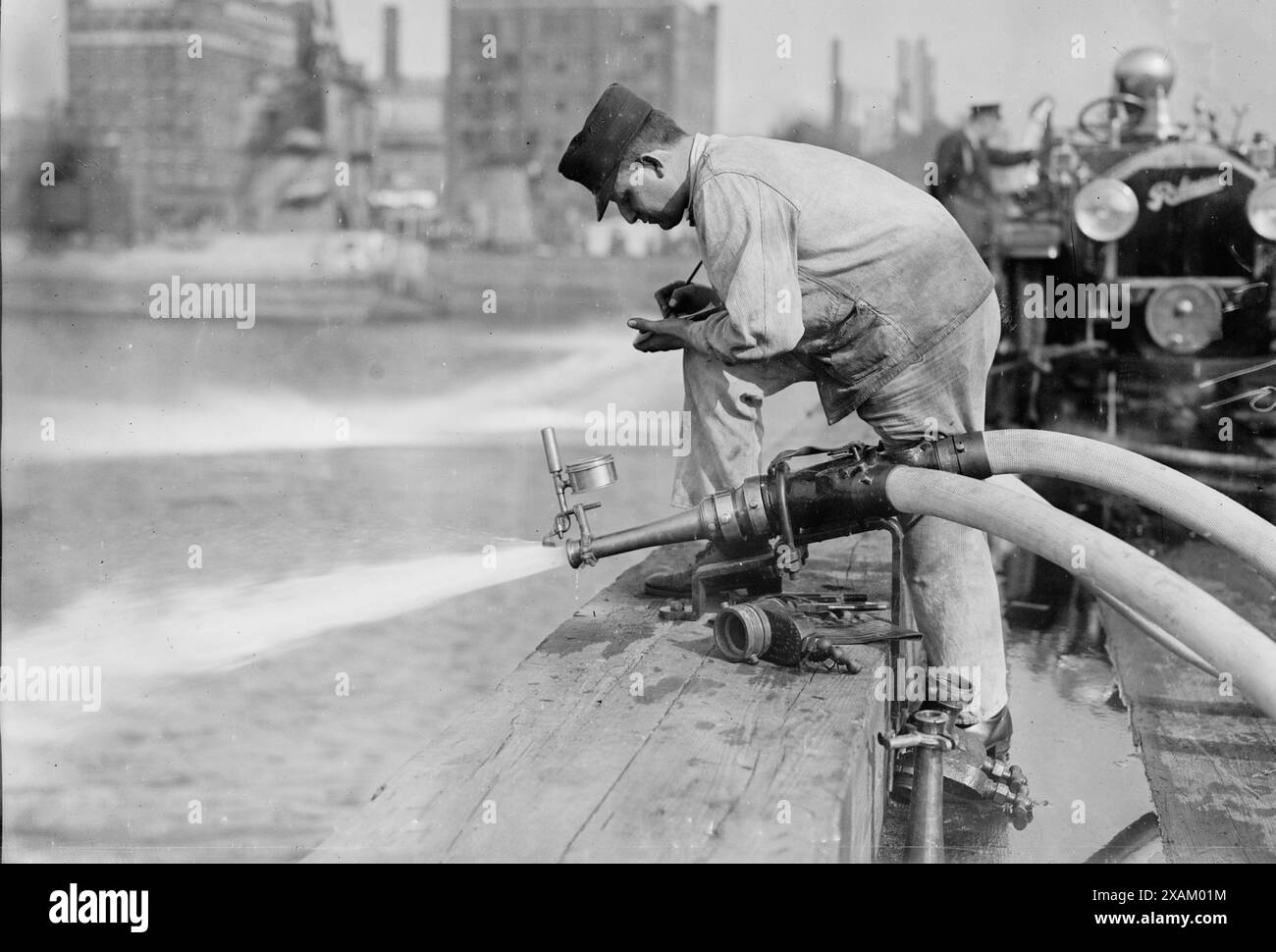 Testing fire engines, 1913. Shows competition of motor pumper engines ...