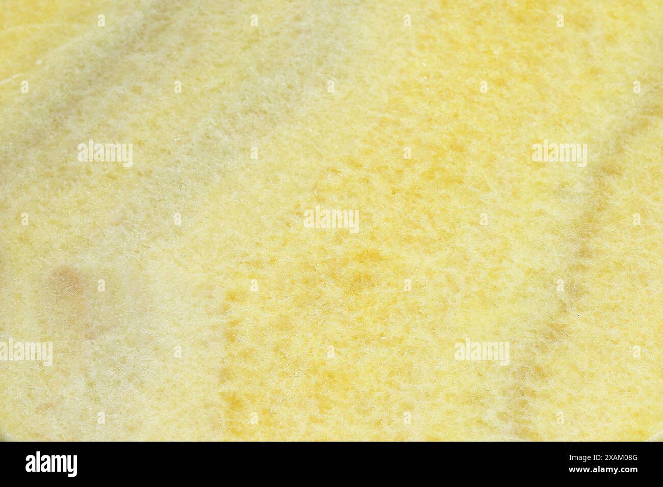 Texture of a yellow quartz stone countertop close-up Stock Photo - Alamy