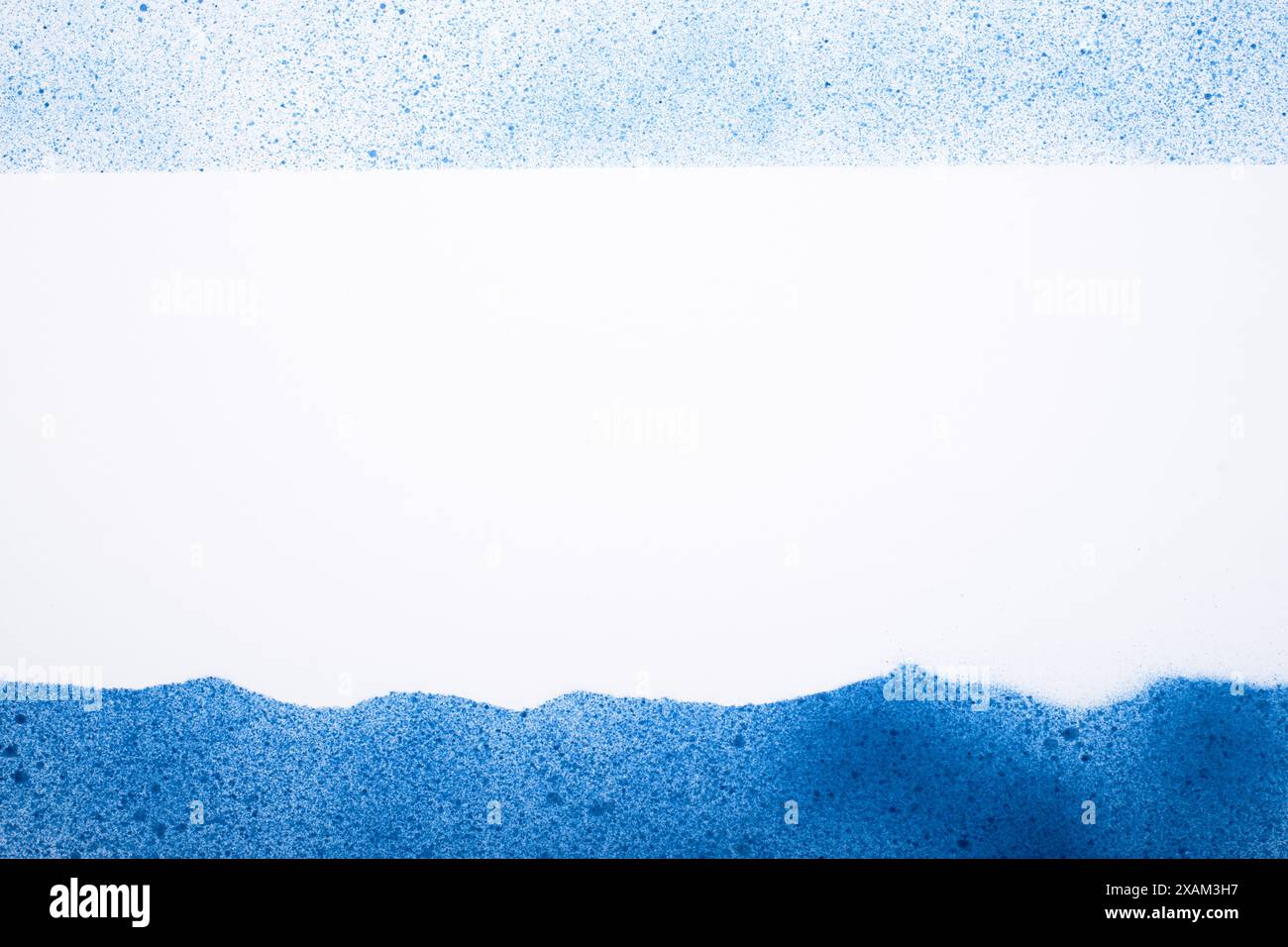White paper with blue spray painted edges. Tear-paper shaped edge. Copy ...