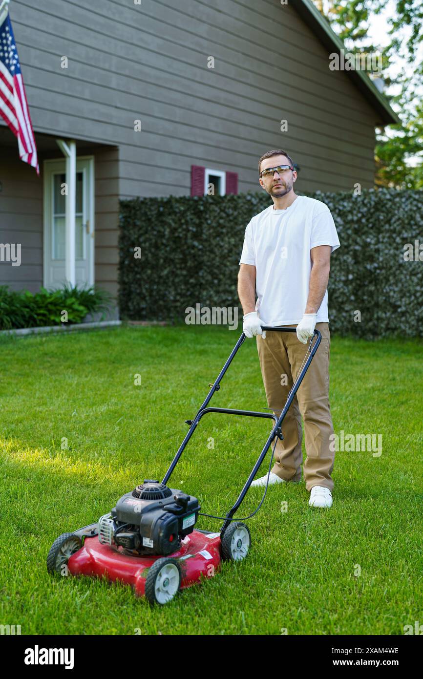 Boy cutting grass hi-res stock photography and images - Alamy