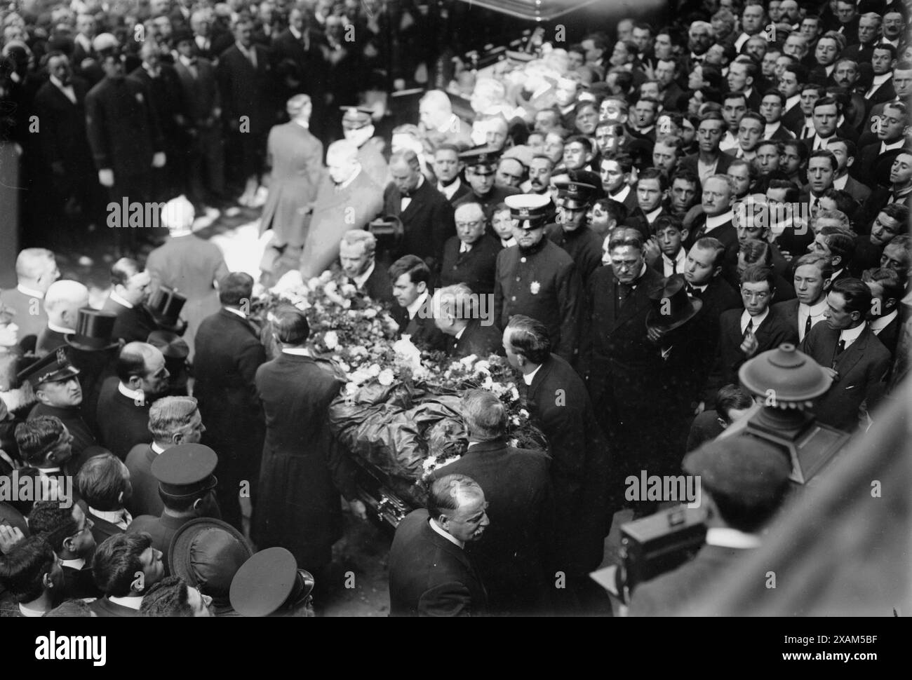 Tim Sullivan's coffin brought out, 1913. Shows funeral for New York ...