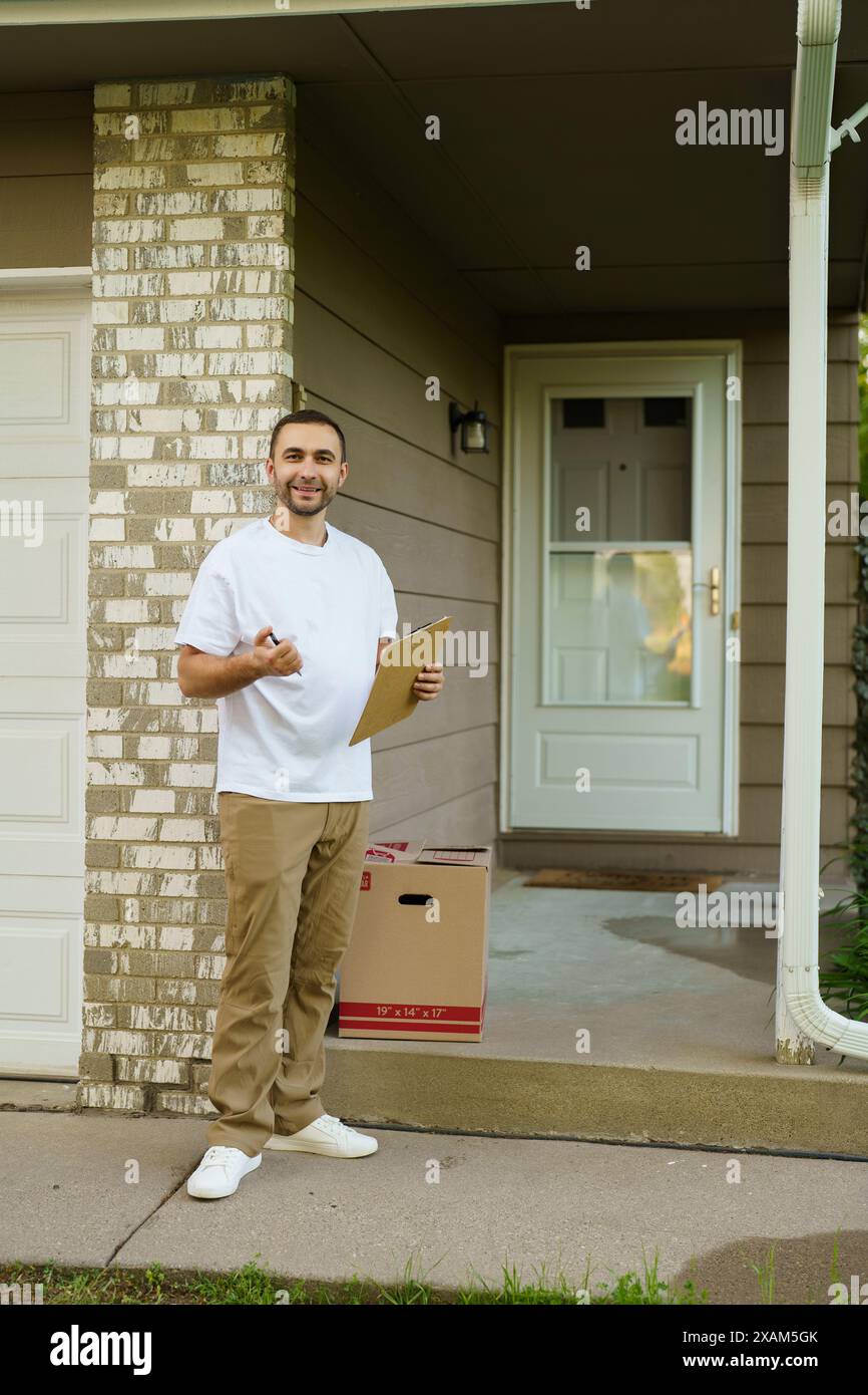 home delivery service, mail, people and shipment concept - man with ...
