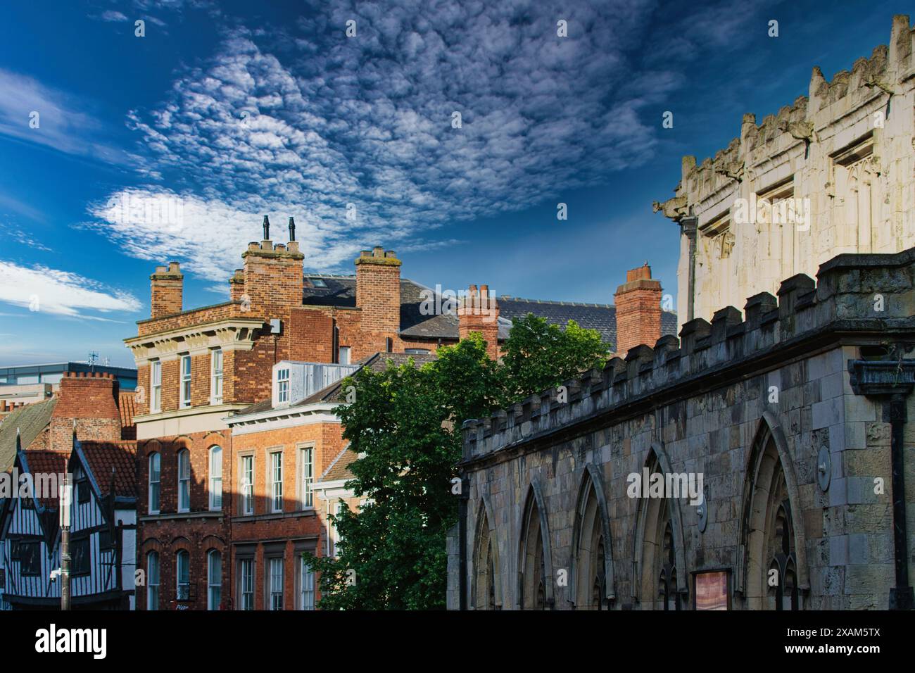 A picturesque view of historic buildings with brick facades and arched ...