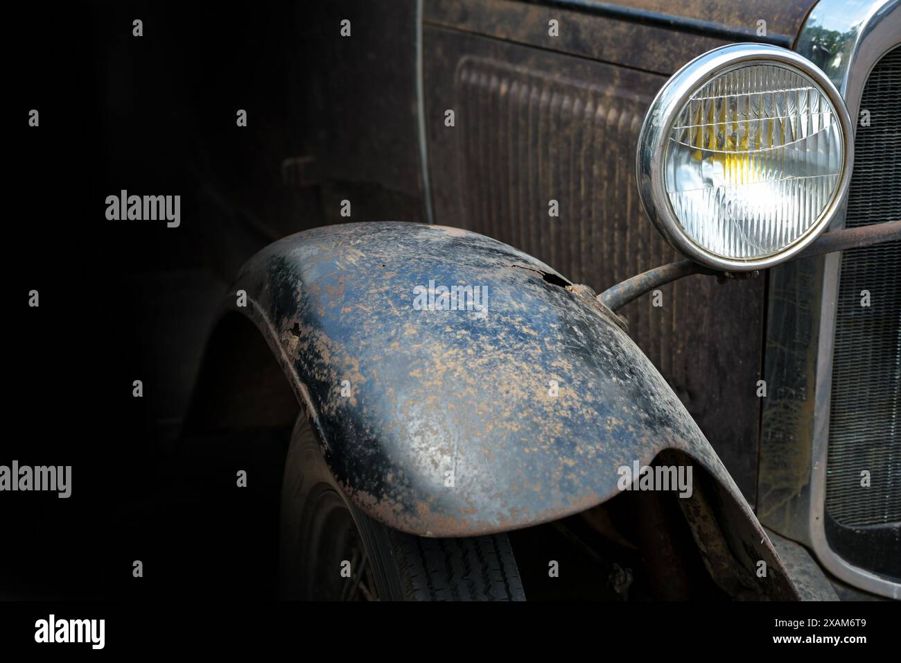 Headlight and mudguard from a rusty black vintage car, concept for a ...