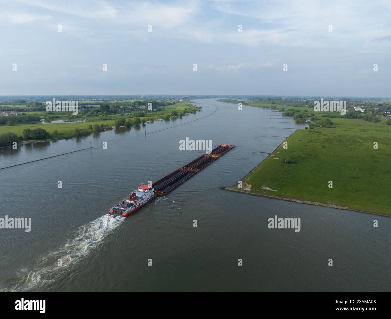 Inland shipping transportation vessels of bulk materials on the Waal ...