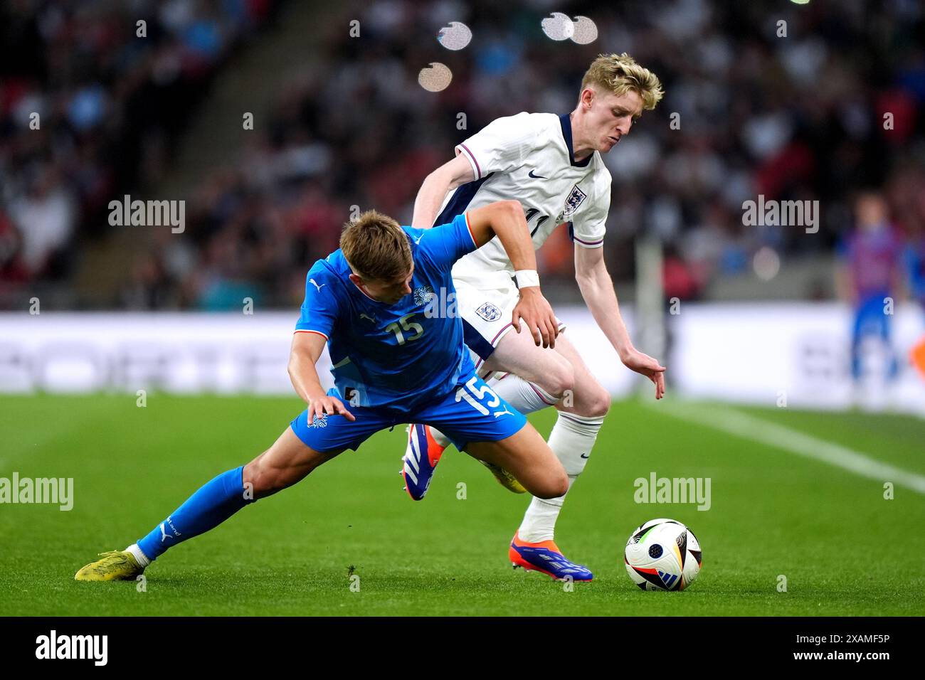 England’s Anthony Gordon, (right) battle for the ball with Iceland’s ...