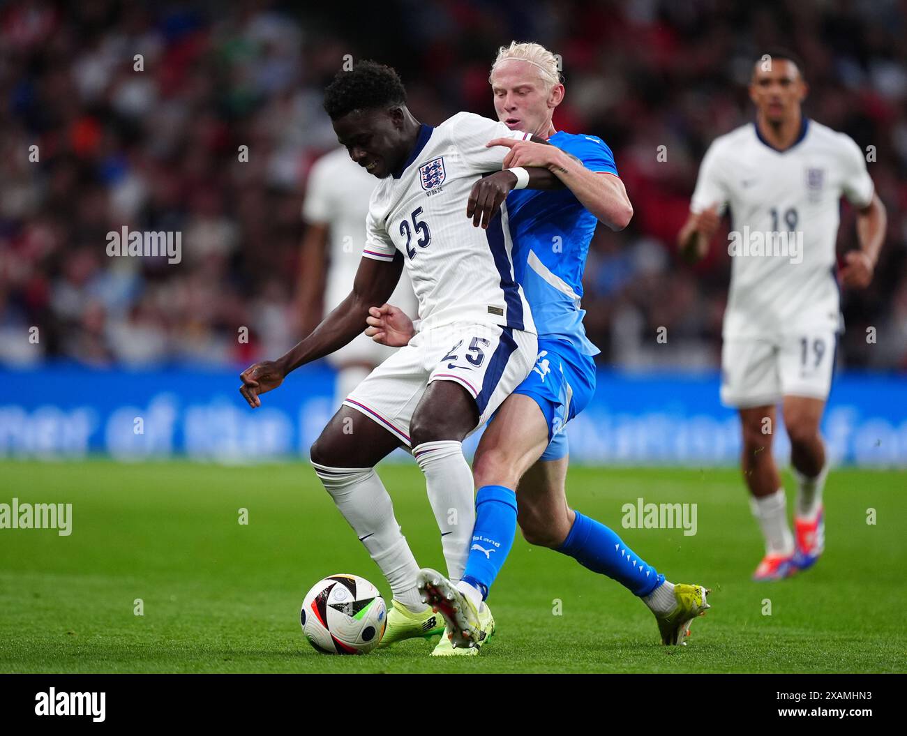 England's Bukayo Saka (left) and Iceland's Kolbeinn Finnsson battle for ...