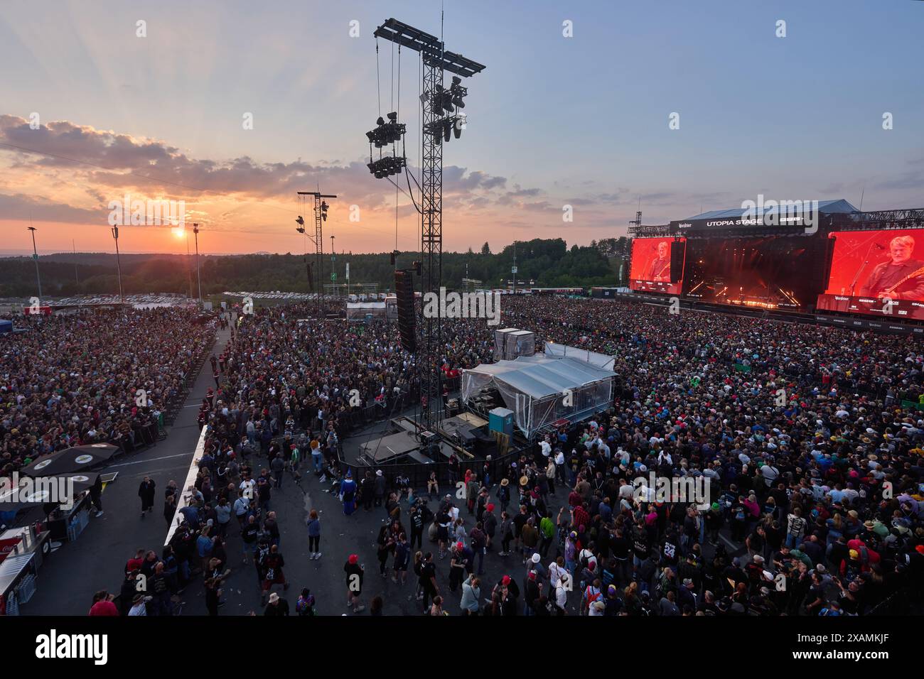 07 June 2024, Rhineland-Palatinate, Nürburg: Rock fans stand in front ...