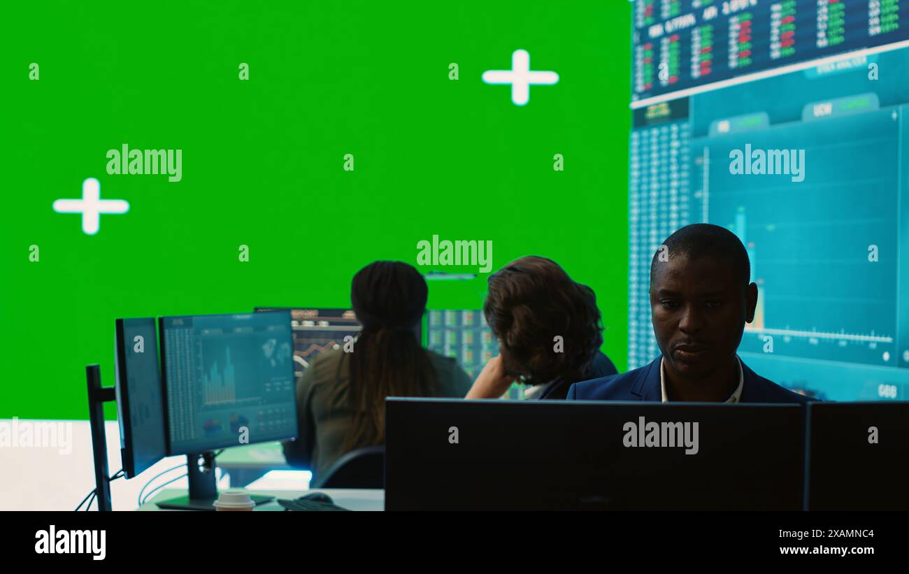 Diverse group of business specialists solve their daily tasks in ...