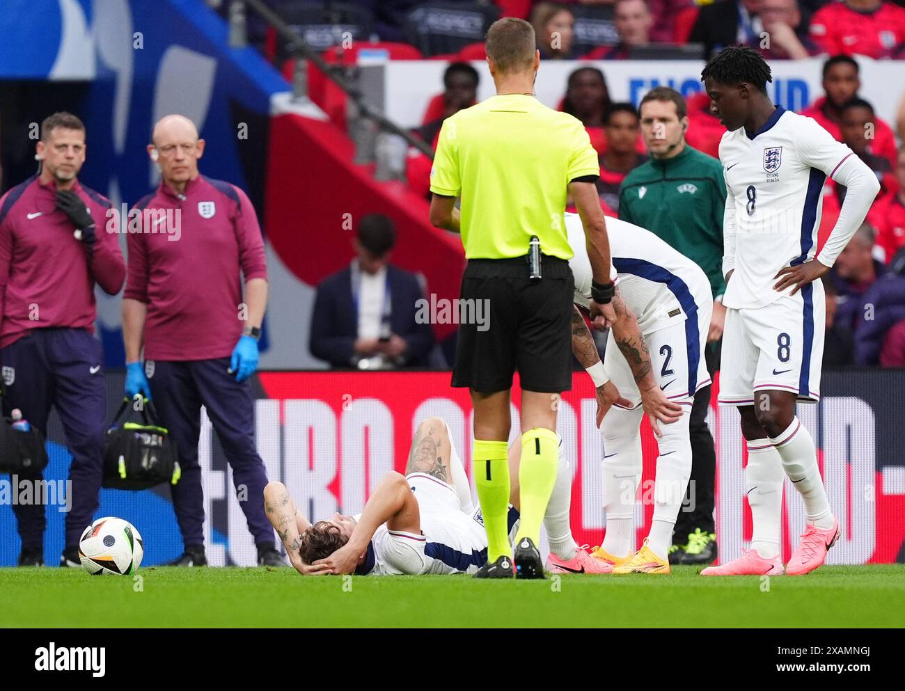 England's John Stones lies in pain after picking up a head injury ...