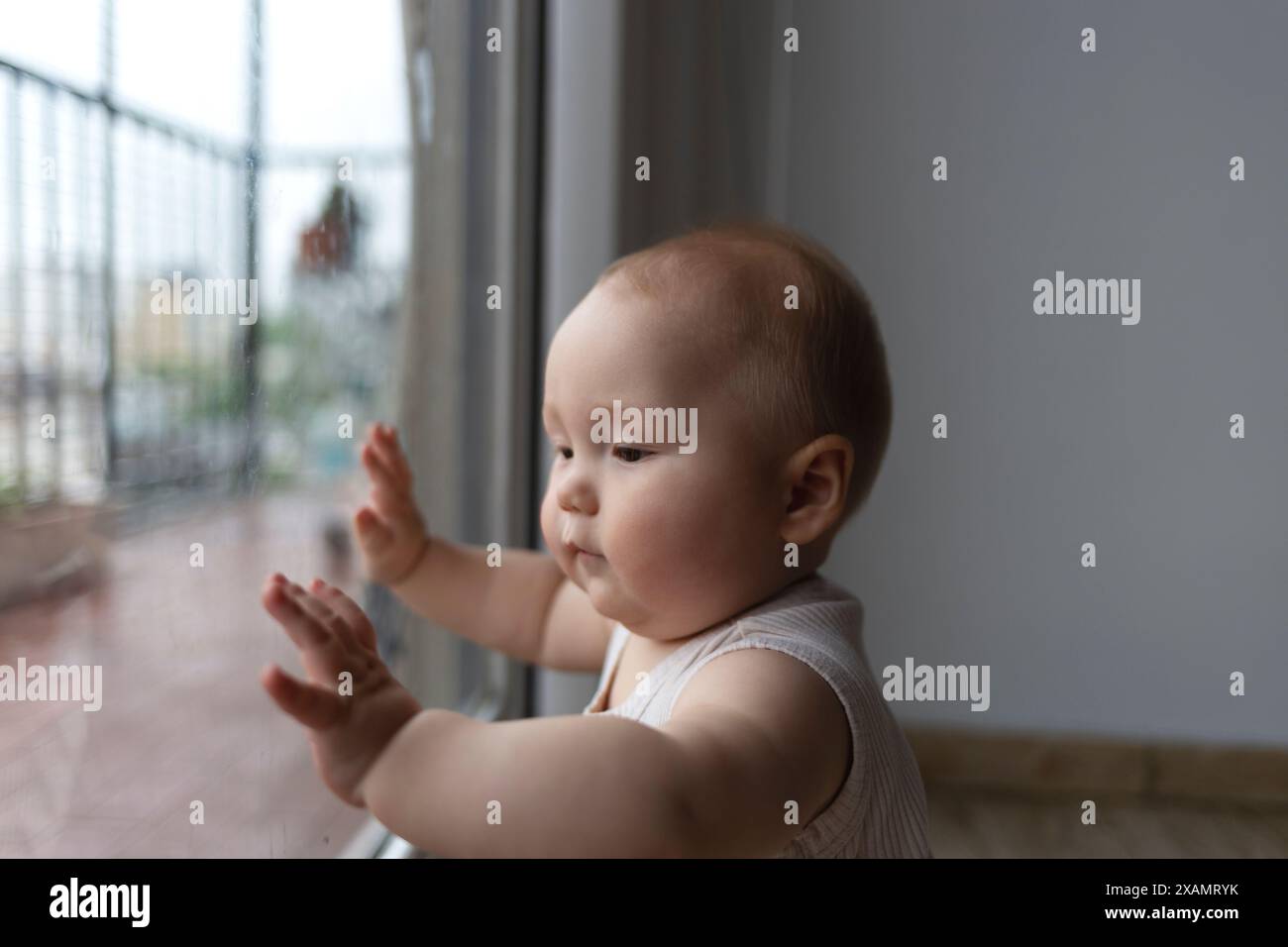 A curious baby exploring the world through a window, full of wonder and ...