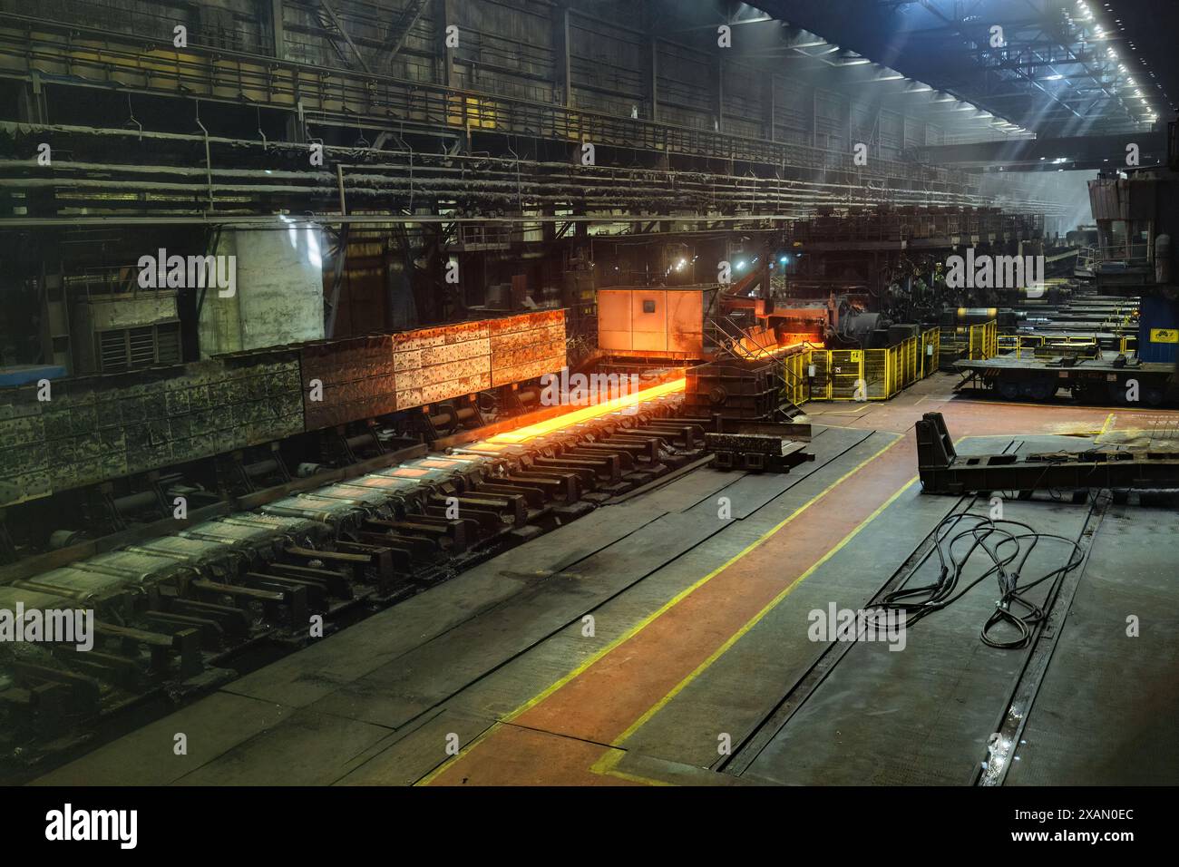 Rolled metal factory. Hot iron slab moving on conveyor of metal rolling mill Stock Photo - Alamy