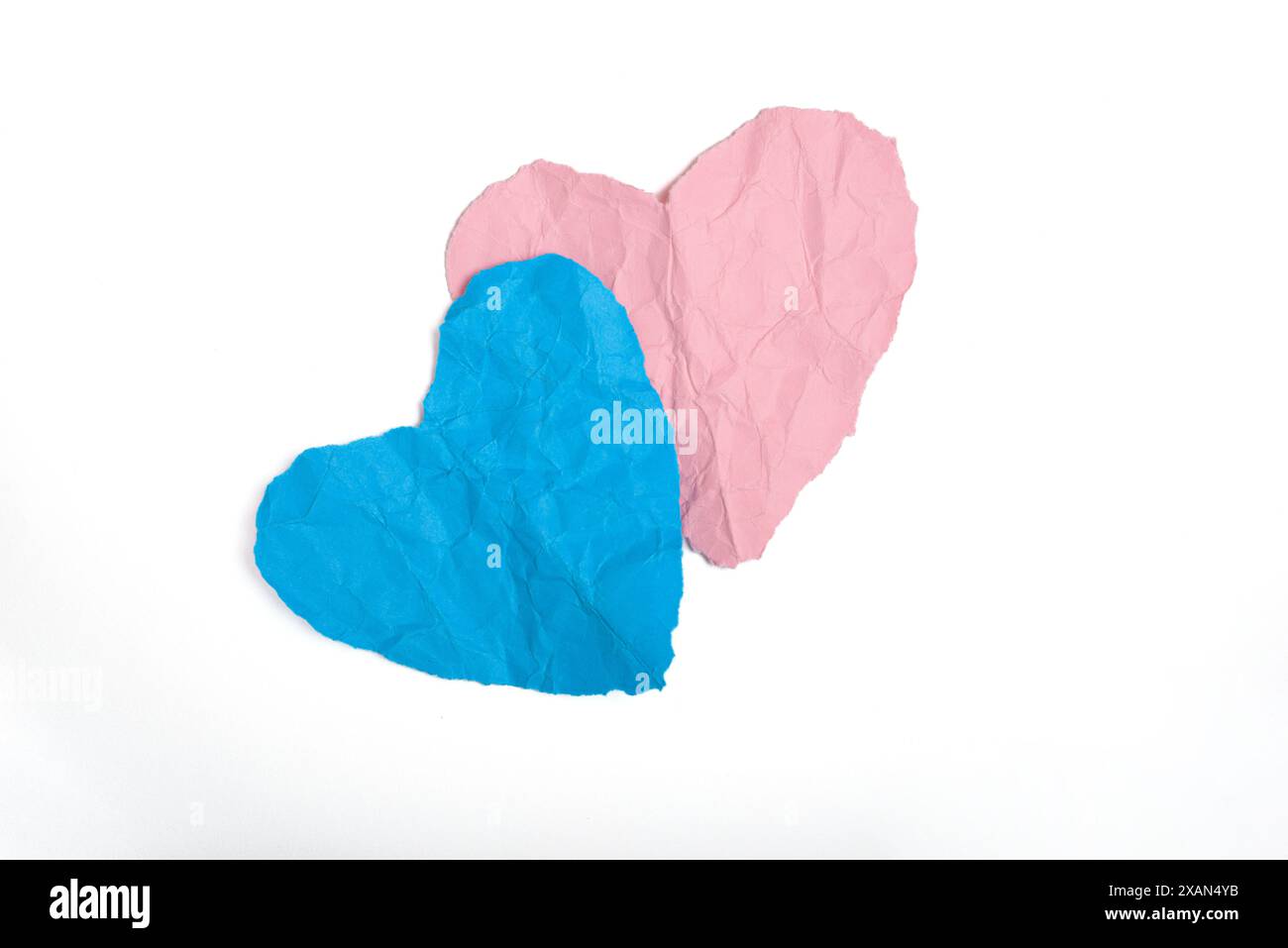 Blue and pink crumpled paper texture in the shape of hearts isolated on ...