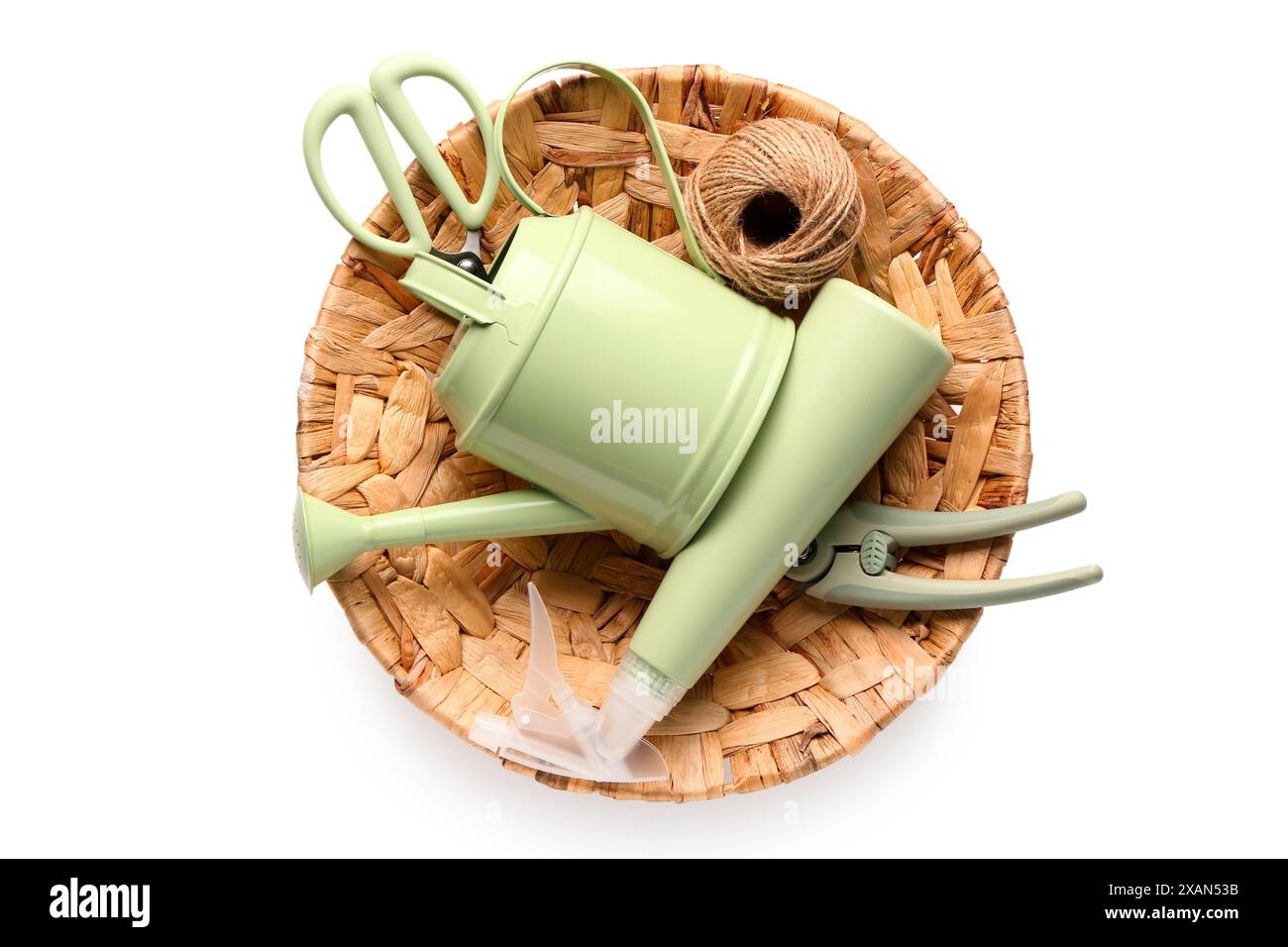 Gardening tools on straw plate on white background. Top view Stock ...