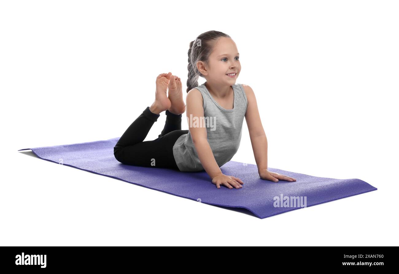 Cute little girl stretching on white background Stock Photo - Alamy