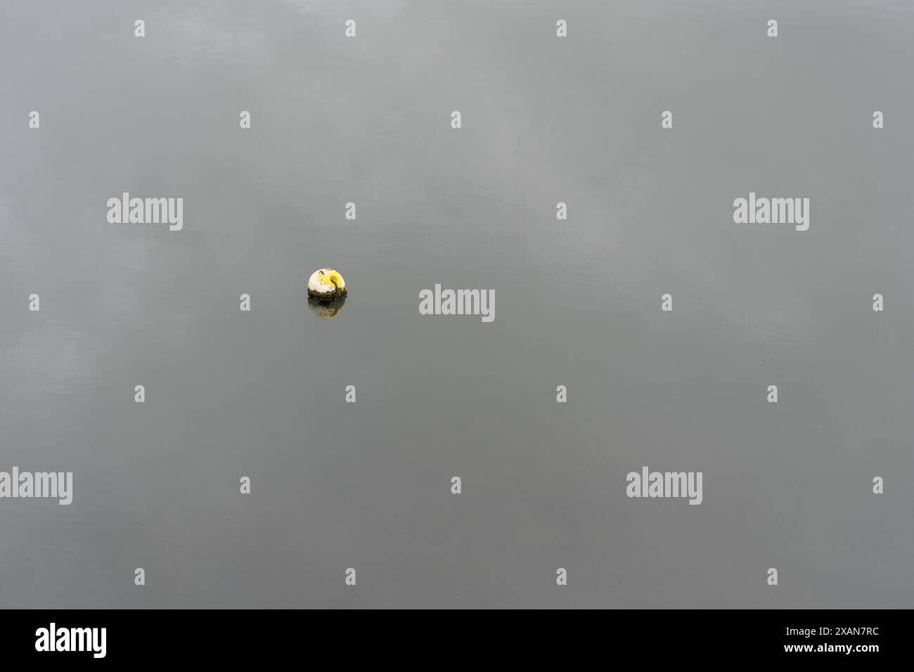 Row boat on calm still lake with boat's reflection on water Stock Photo ...