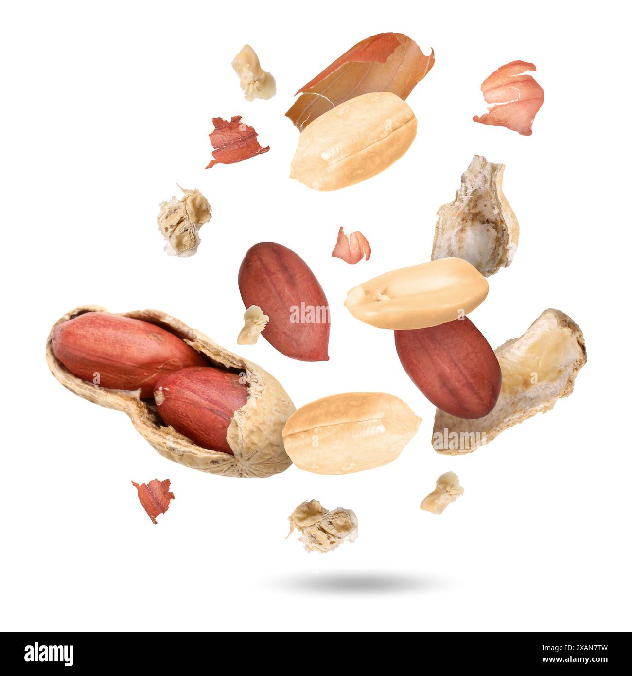 Peanuts and crushed pod in air on white background Stock Photo - Alamy