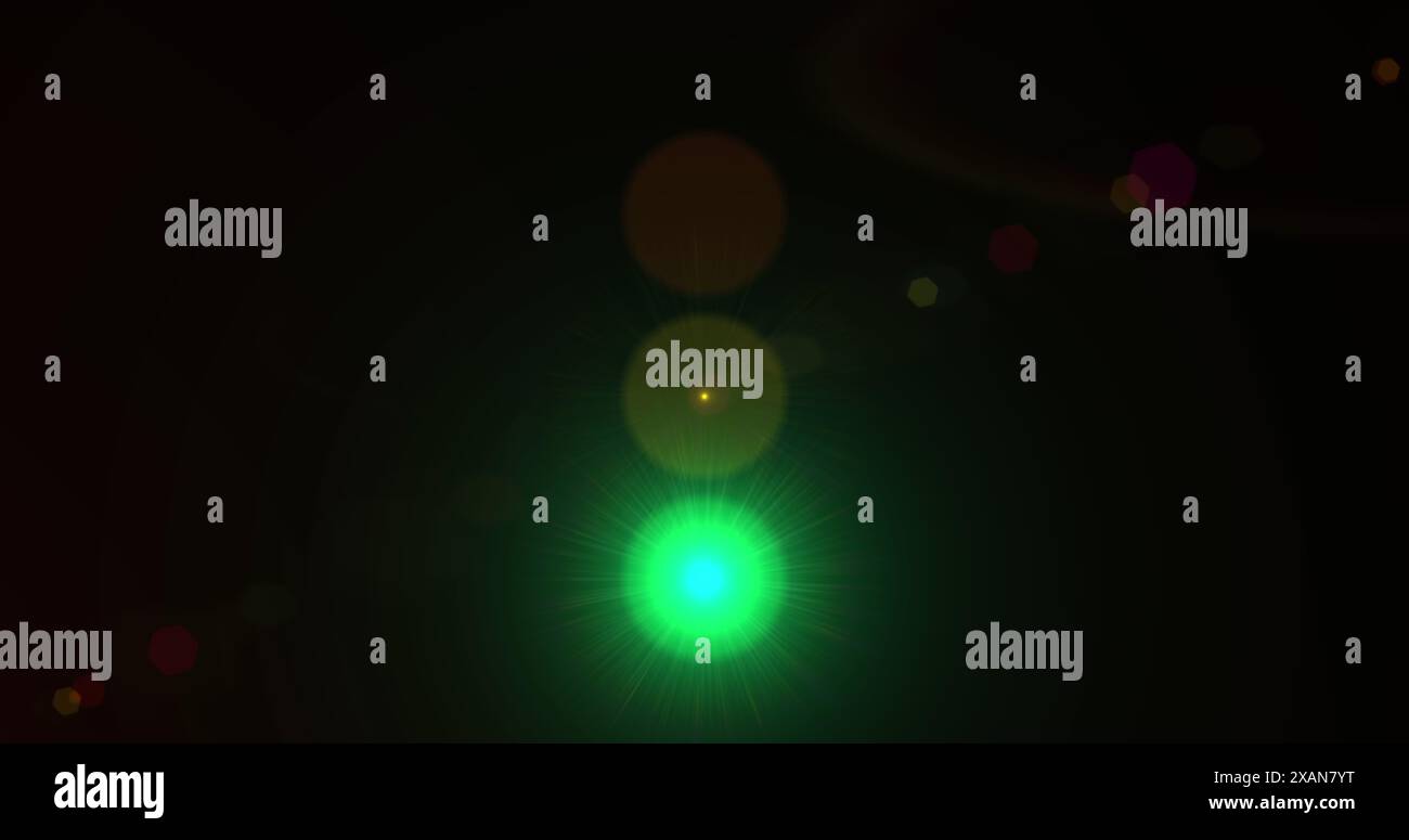 Image of yellow light and red star moving on black background Stock ...