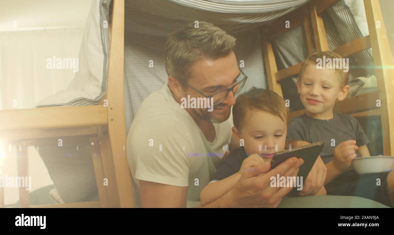 Image of light spots over happy caucasian father using tablet with sons ...