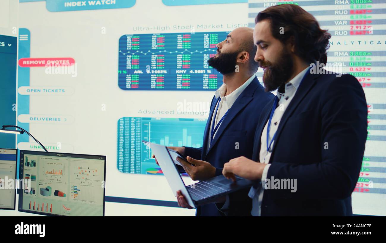 Team of investors analyzing profit amount and making decisions to fund ...