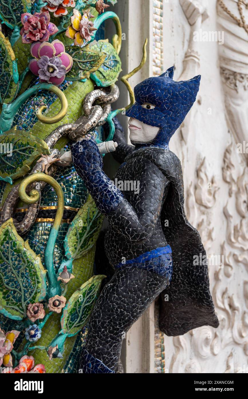 June 5, 2024, Bangkok, Thailand: Temple carving of Batman, in a female ...