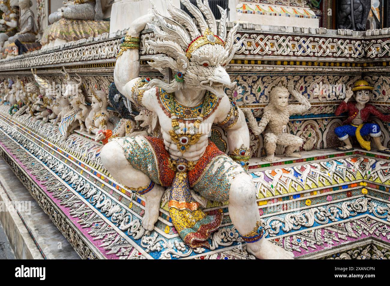 A close-up of a mythical creature sculpture, at Wat Pariwat Temple. The ...