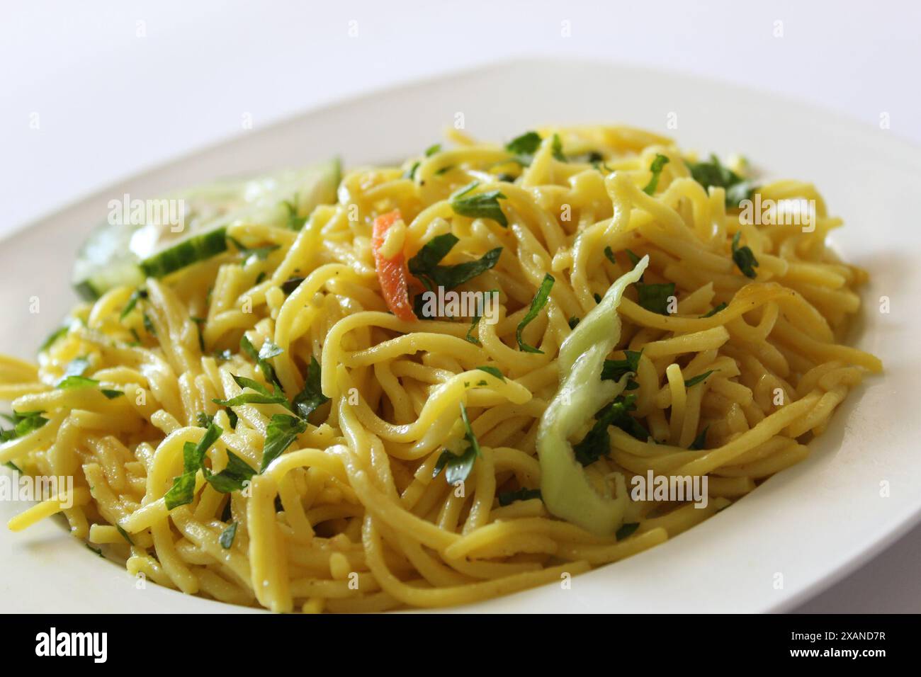 Bami Goreng, mie goreng, Indonesian fried noodles on a white plate ...