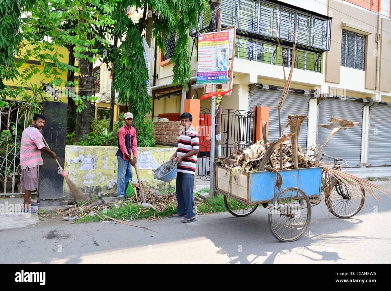 Manual Street Cleaner cleaning street in Barasat Stock Photo - Alamy