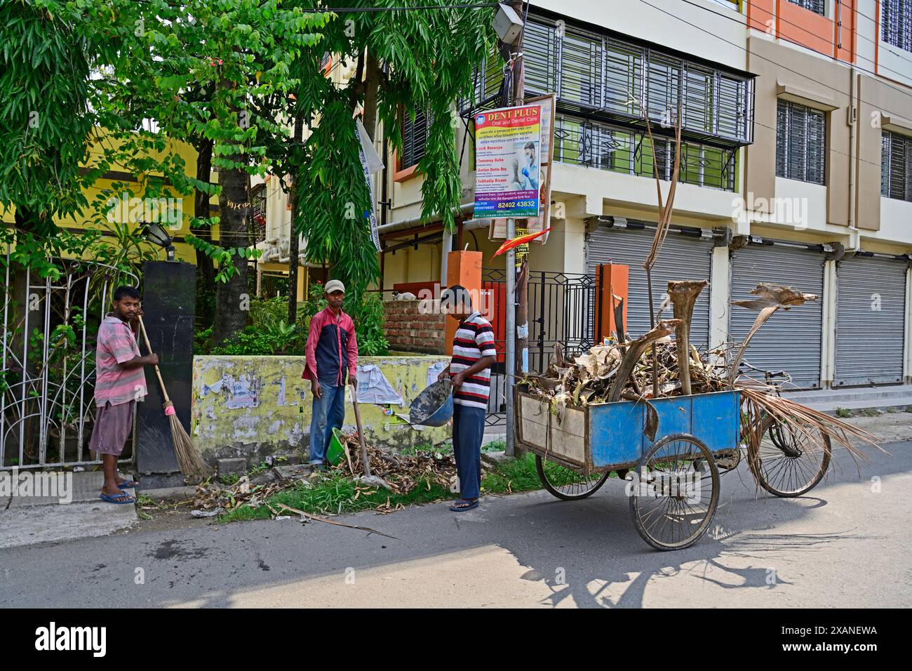 Manual Street Cleaner cleaning street in Barasat Stock Photo - Alamy