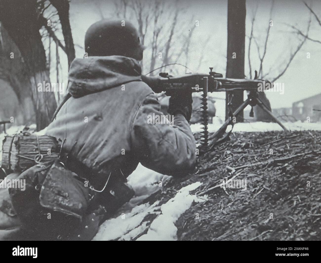 World War Two B&W photo German Machine Gunner fires his weapon from a ...