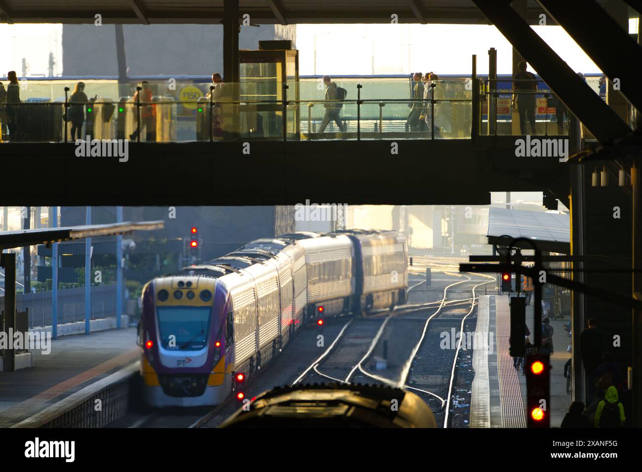 Public transport Melbourne commuter train on train tracks arrives at ...