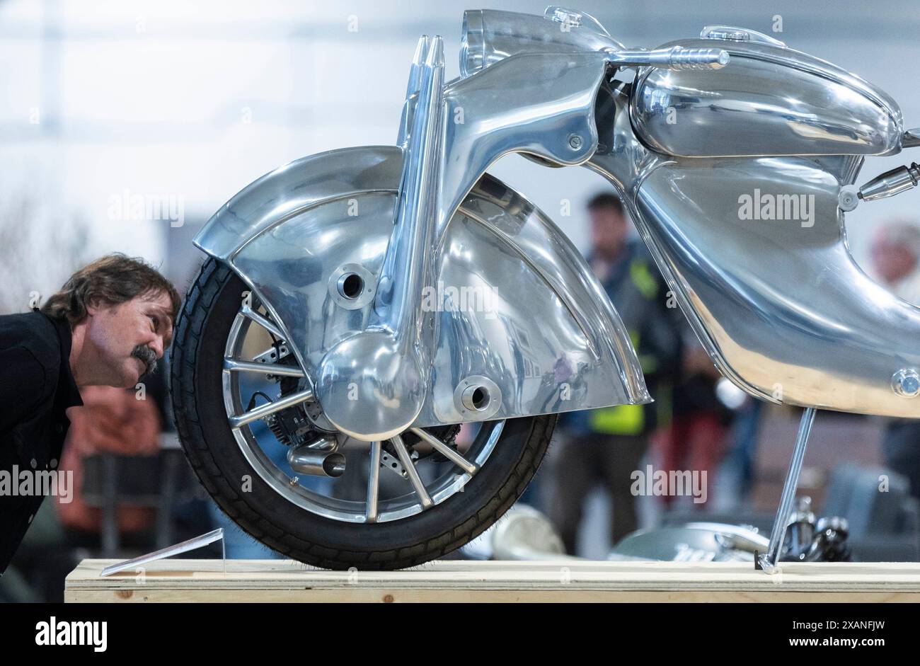 Toronto, Canada. 7th June, 2024. A visitor looks at a custom motorcycle ...