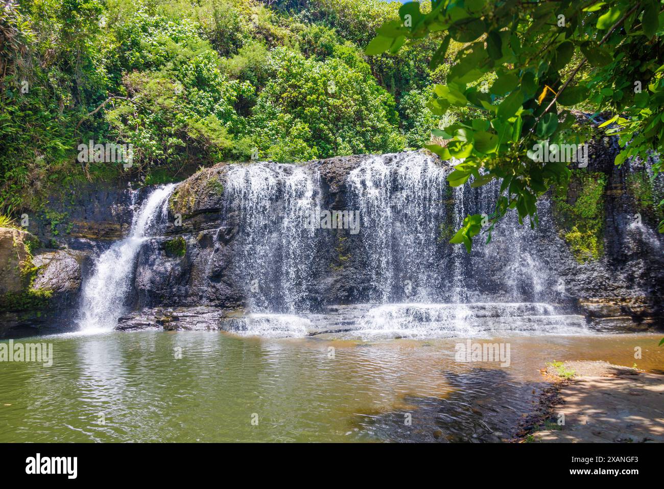 Landscape of Talofofo Waterfall with jungle and blue sky in the ...