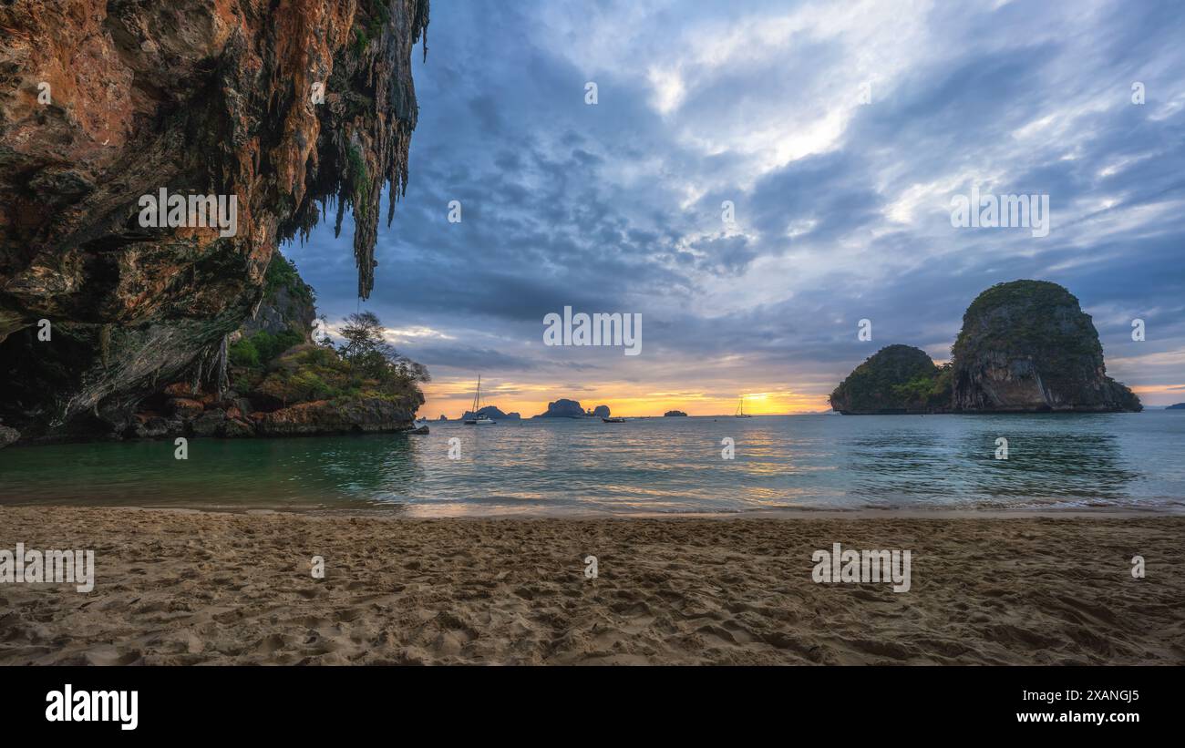 beautiful sunset from railay beach, princess cave in krabi in thailand ...
