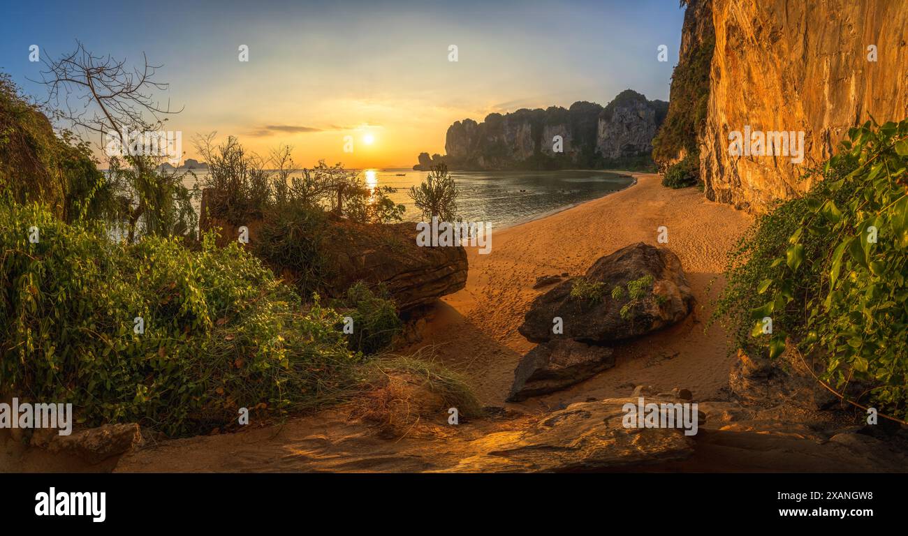 beautiful sunset at tonsai beach on tropical island railay in krabi in ...