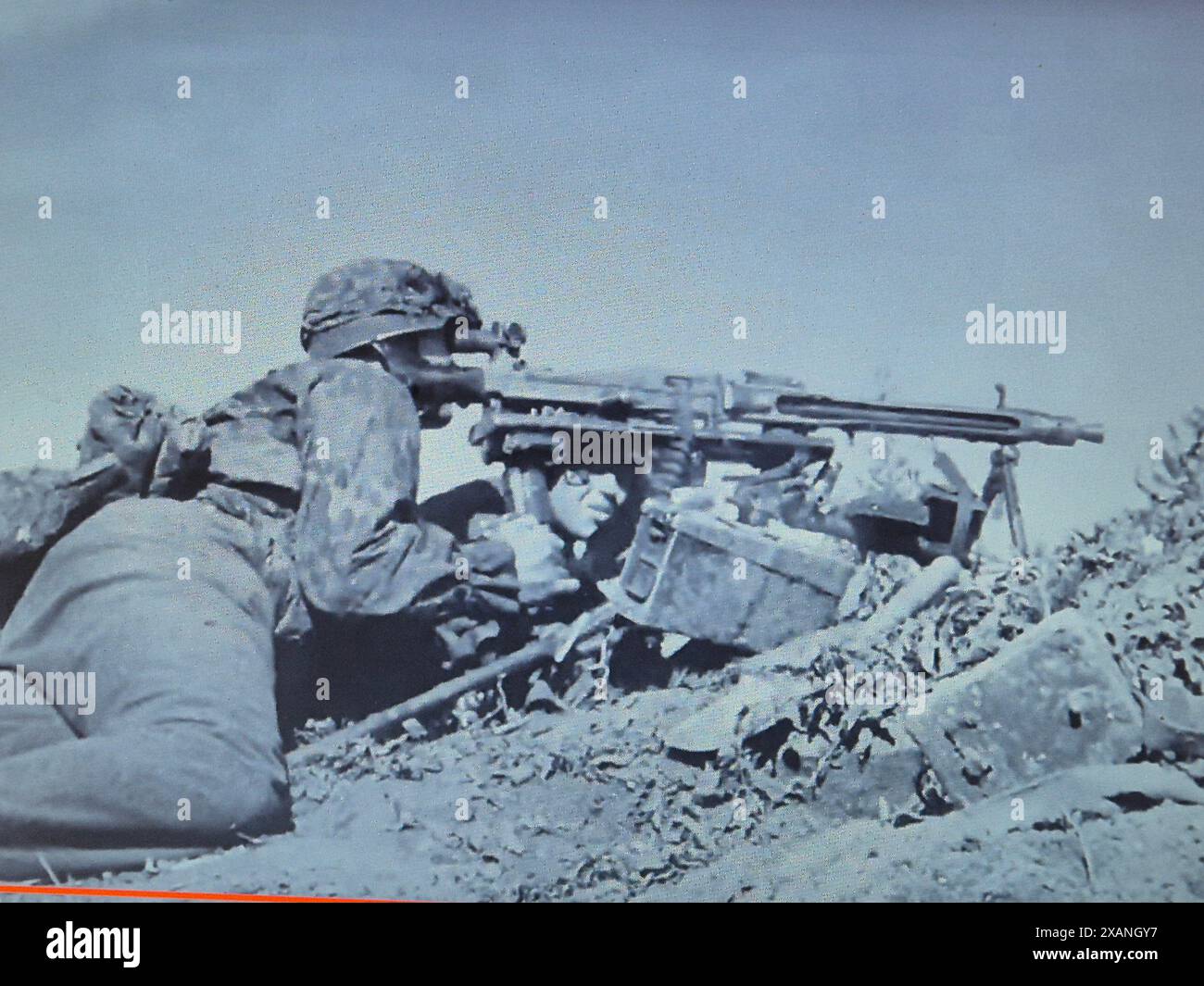 World War Two B&W Screenshot photo. German Soldier fires an MG42 from ...