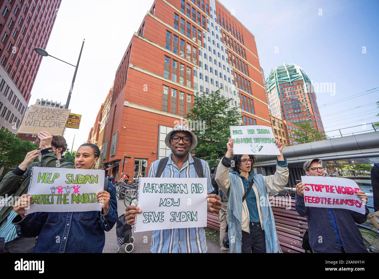 Demonstrators hold flags and placards expressing their opinion, during ...