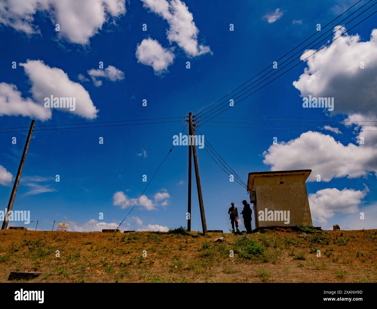 Military Security Post with Rural Landscape with Utility Poles and ...