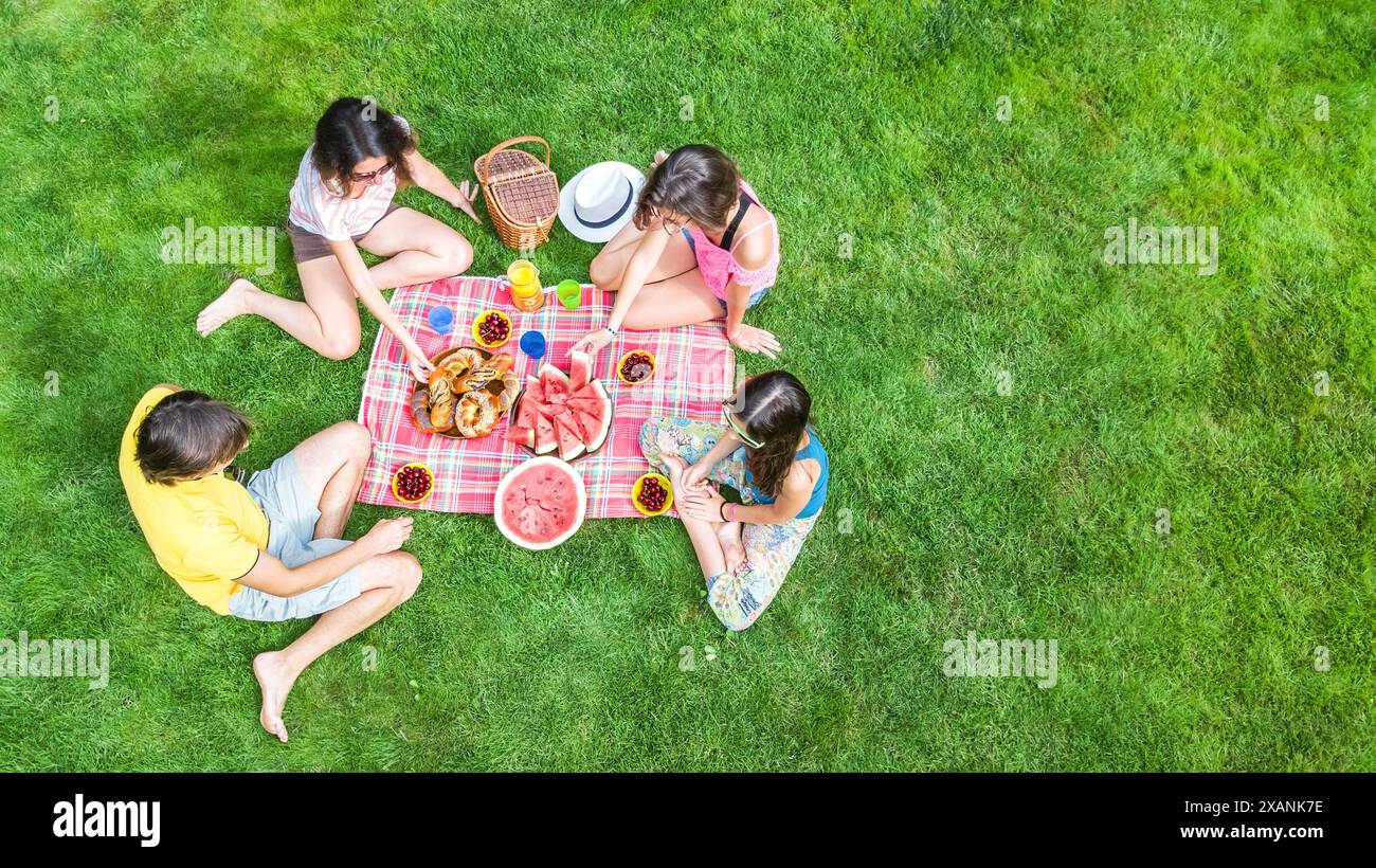 Happy family with children having picnic in park, parents with kids ...